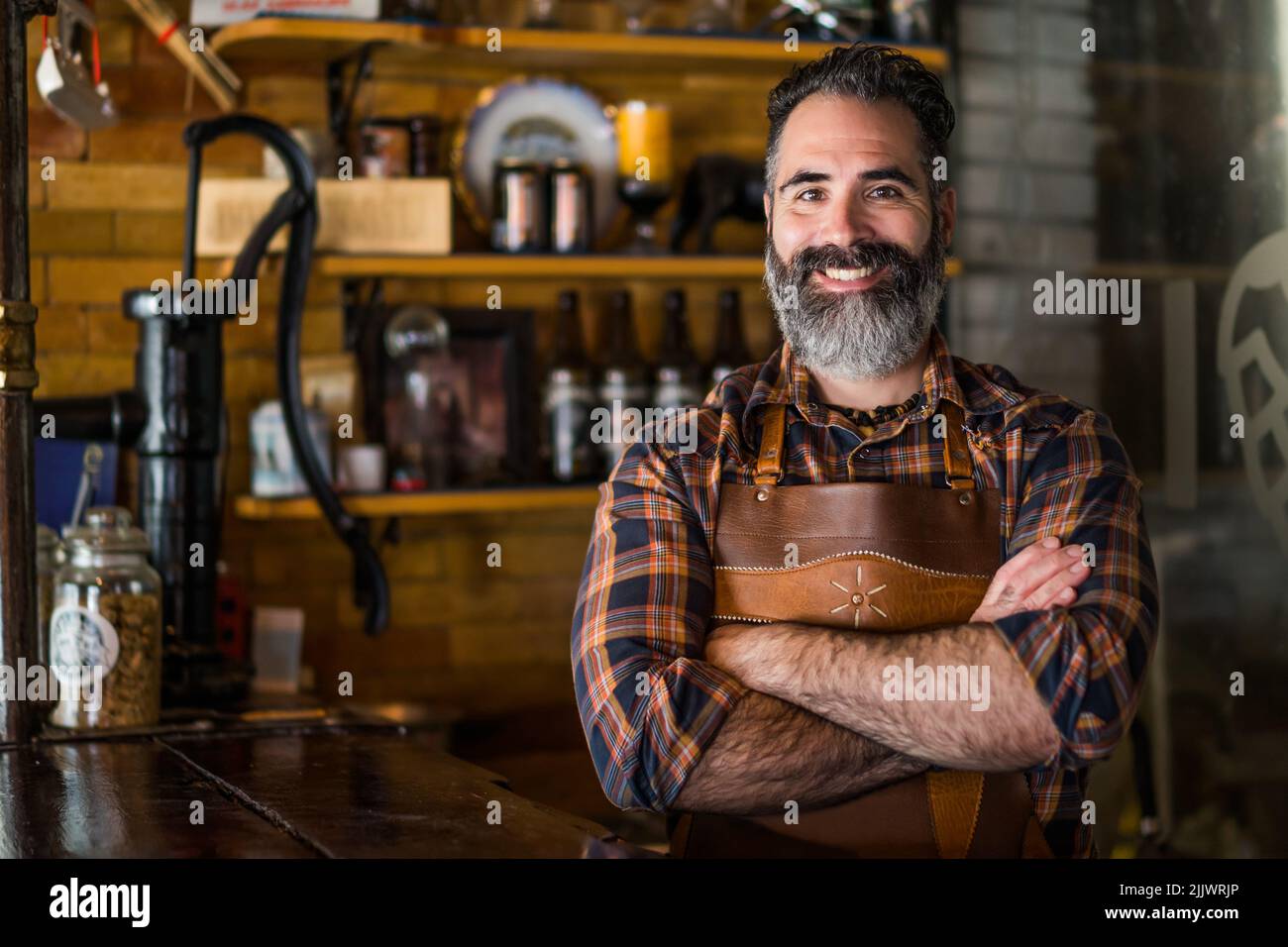 Portrait of cheerful barmen at pub Stock Photo - Alamy