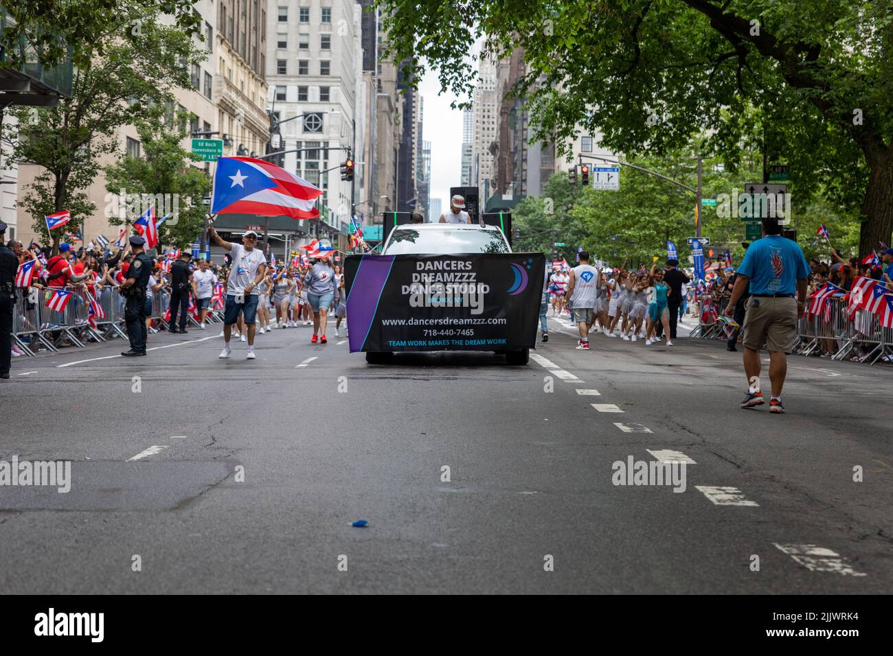 A large crowd of people coming out to celebrate the Puerto Rican Day ...
