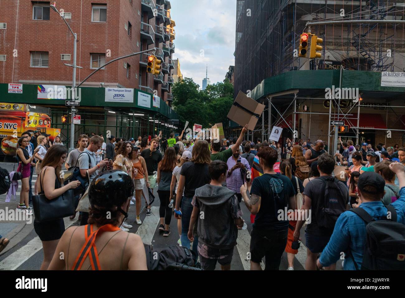 A group of protesters with cardboard signs walking to Foley Square, New ...