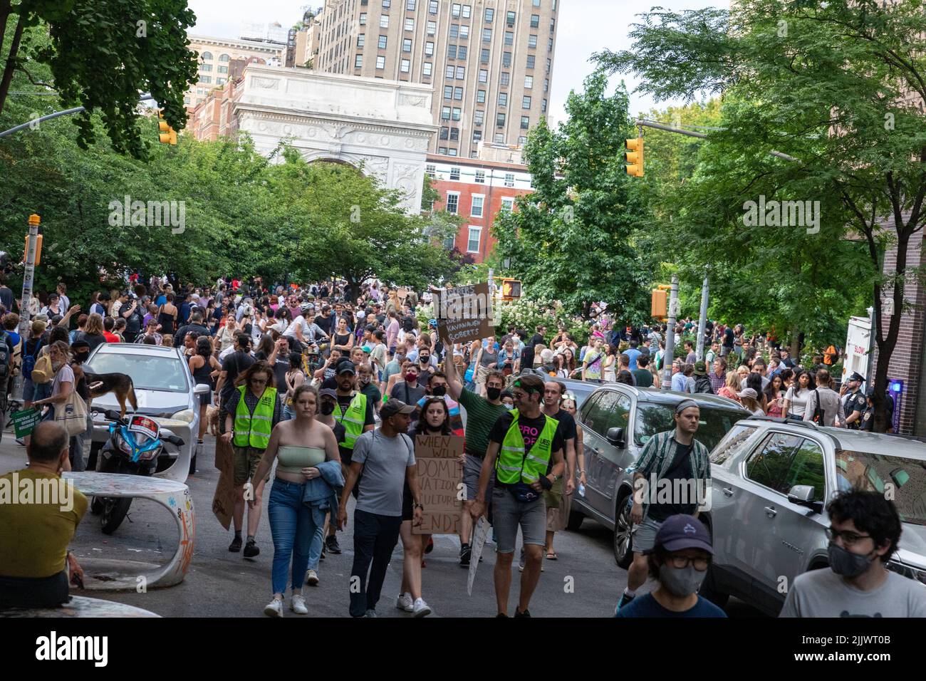 A group of protesters with cardboard signs walking to Foley Square, New ...