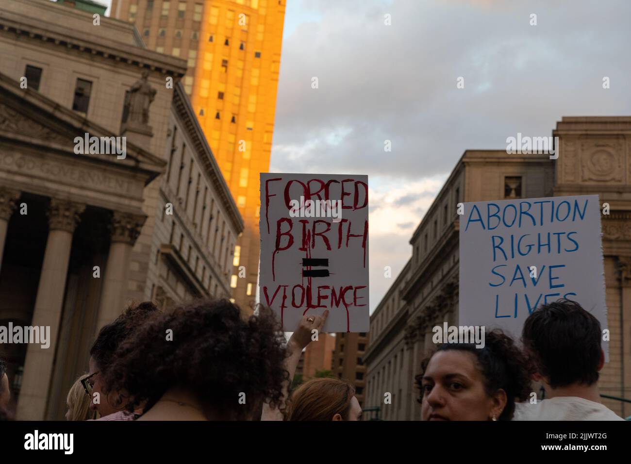 A group of protesters with cardboard signs gather at Foley Square, New ...