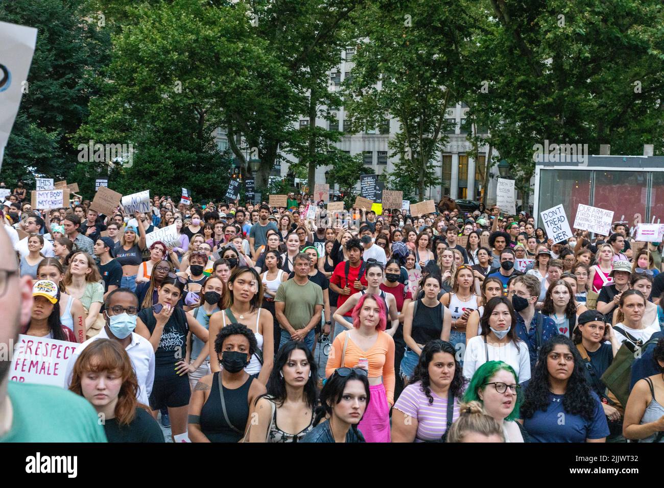 A group of protesters with cardboard signs gather at Foley Square, New ...