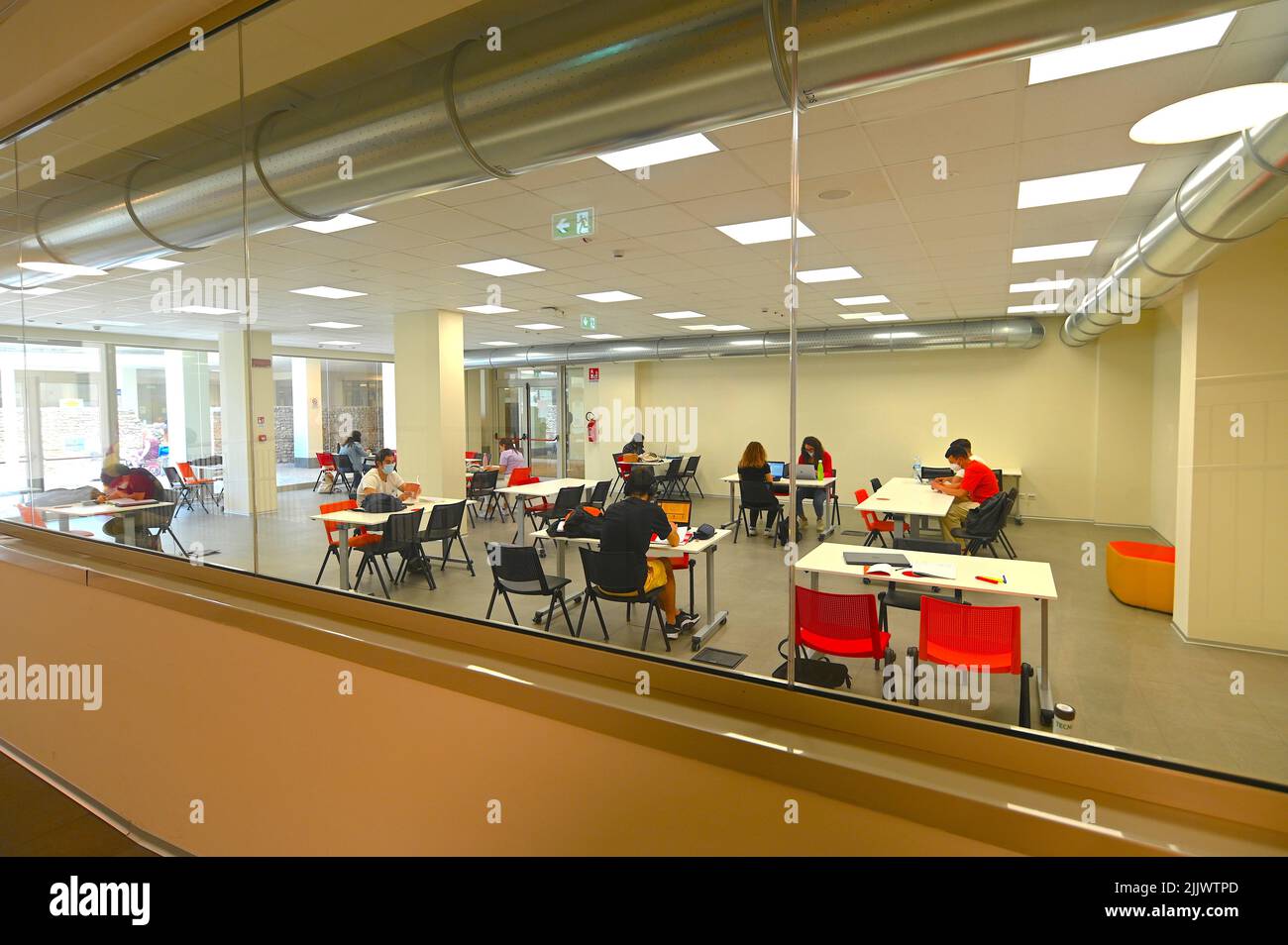 A group of people in a study room at the university campus in Turin ...