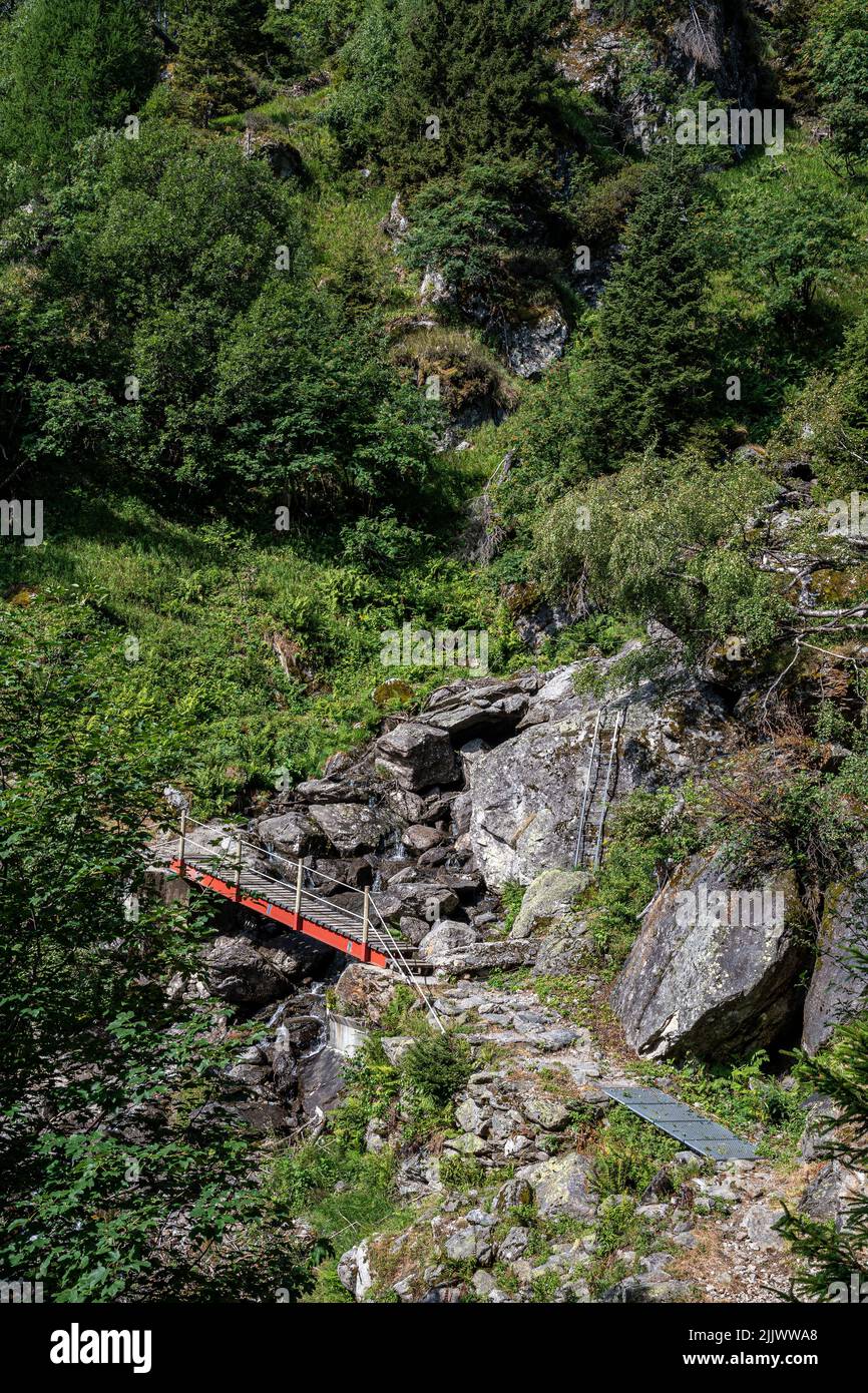 Bridge over a stream for a mountain path Stock Photo - Alamy