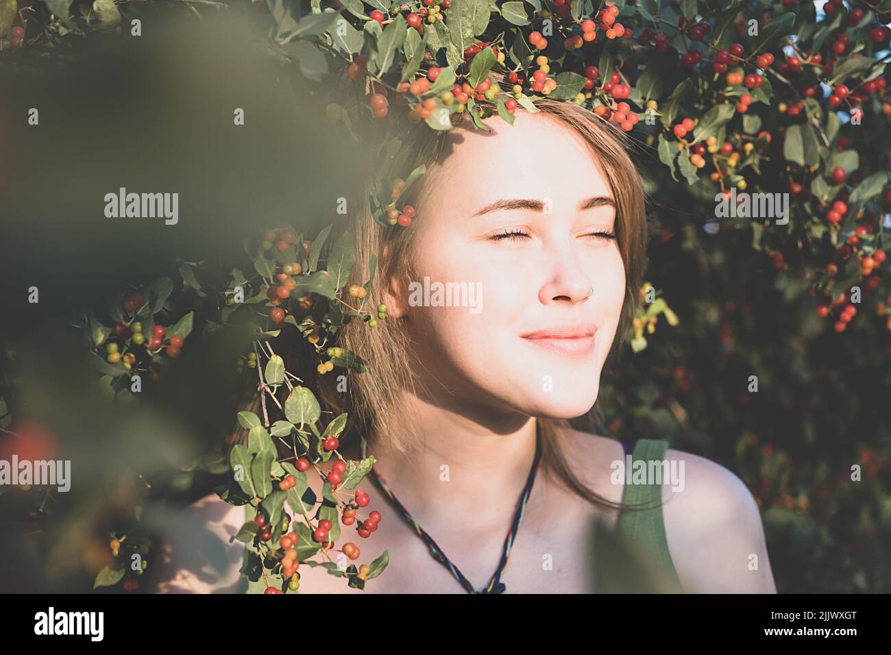 Woman enjoying forest. Female portrait in sunset glow at woodland. Toned image Stock Photo - Alamy