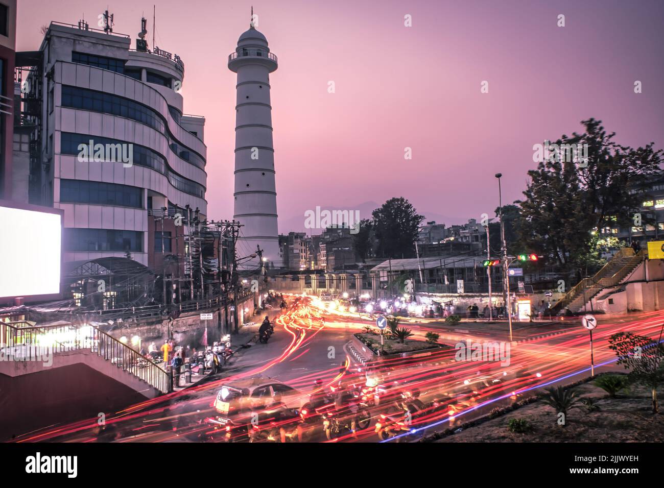 A beautiful pink and purple sunset with Dharahara Tower in Kathmandu ...