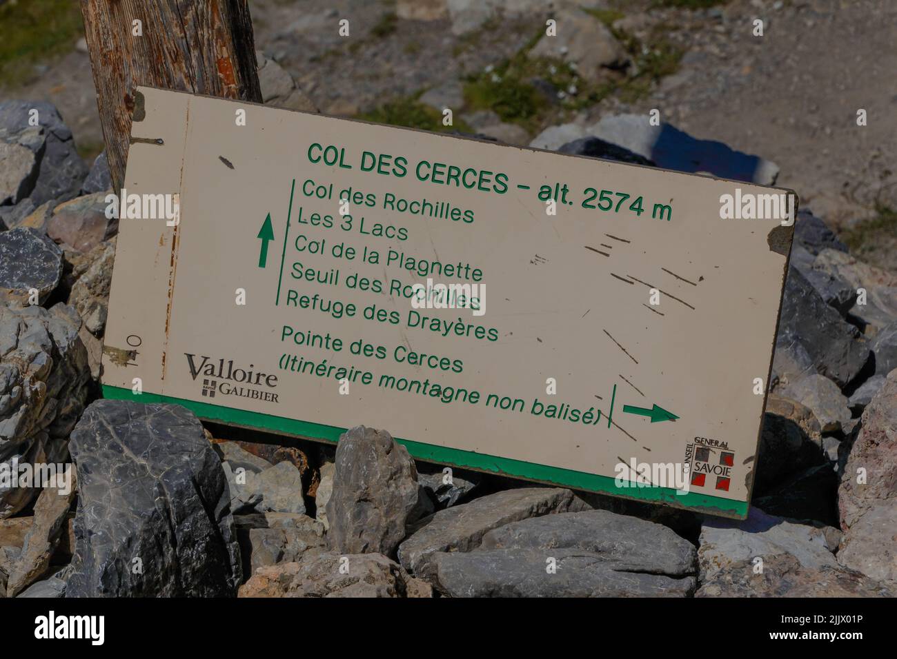 An old sign with information about directions in Col du Galibier ...