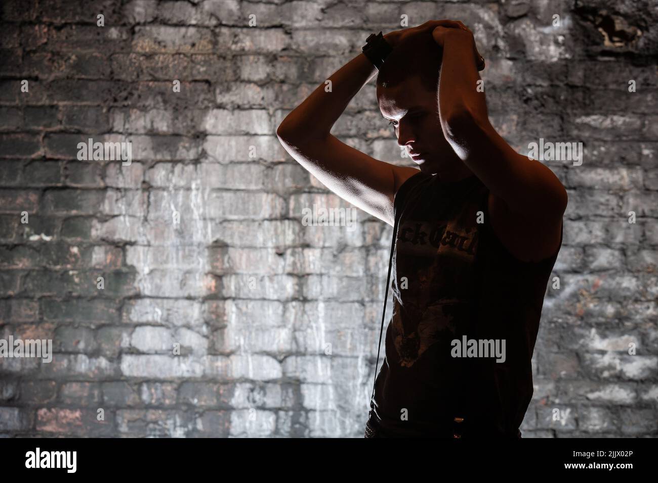 Urban attitude: dark despair. A moment of frustration from a young man ...