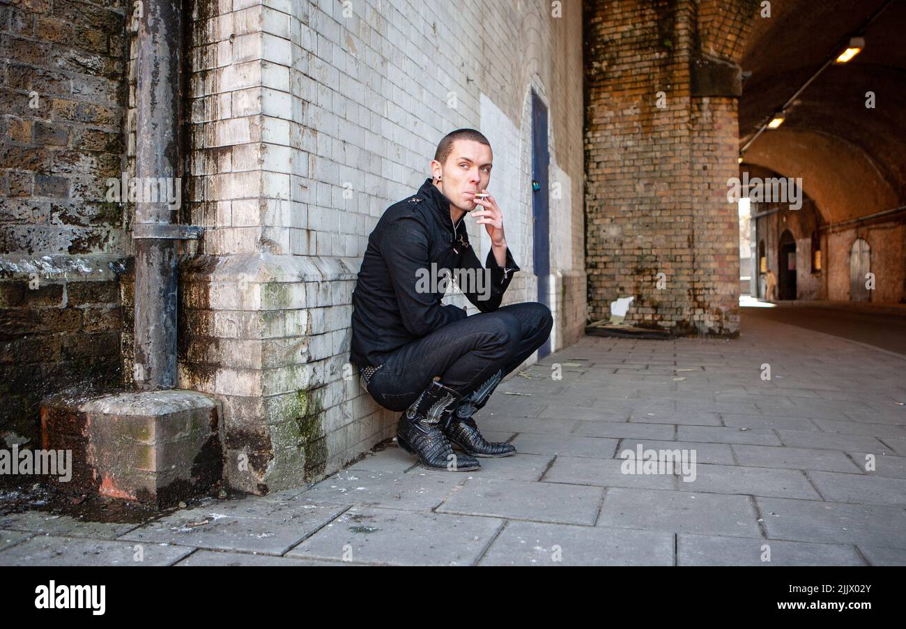 Urban attitude: bad habits. An alternative lifestyle character smoking ...