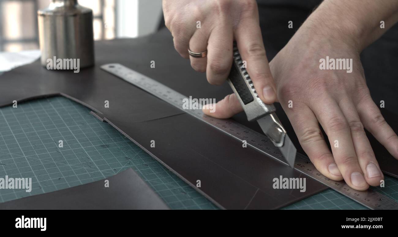 Working process of crafting a new handmade leather wallet in the ...