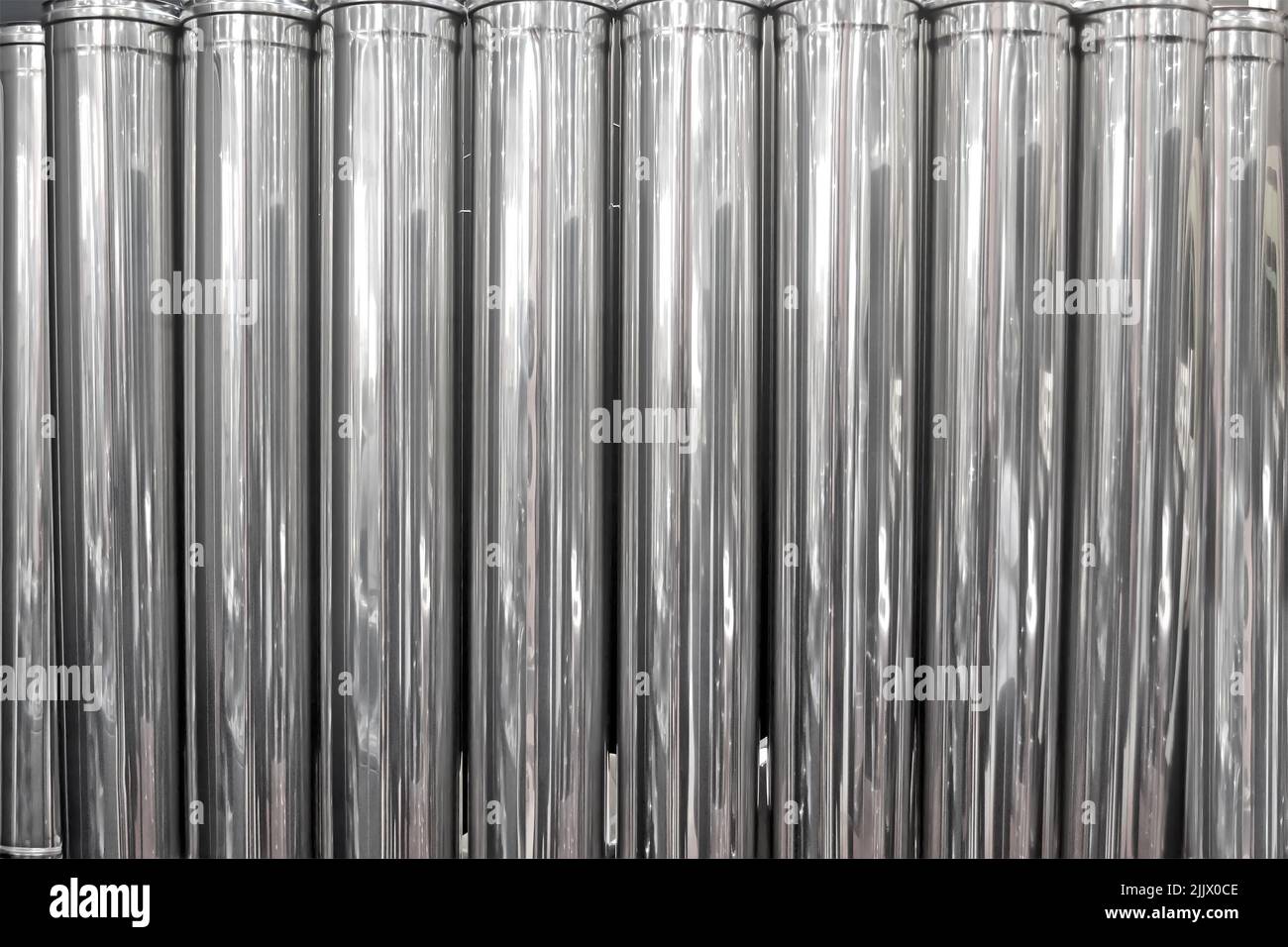 silver metal tubes closeup, modern industry diversity Stock Photo - Alamy