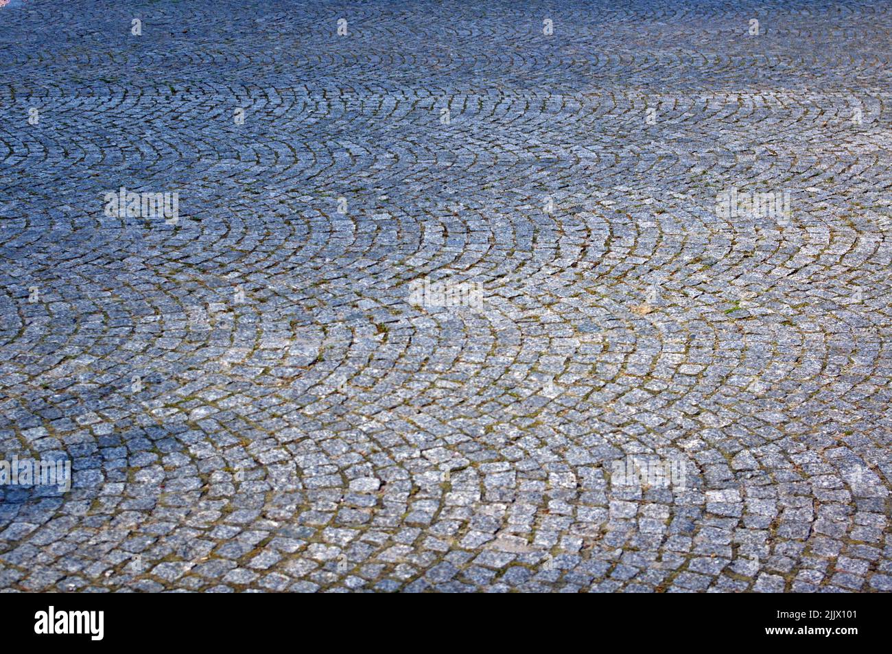 Pavement made of old stone cobblestones Stock Photo - Alamy