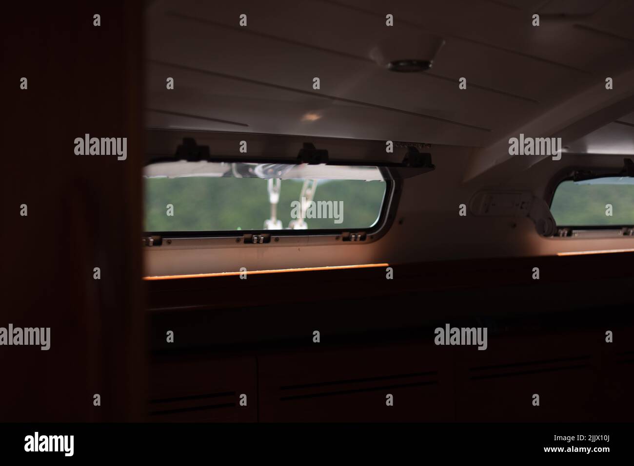 A view of a half-open window of a boat Stock Photo - Alamy