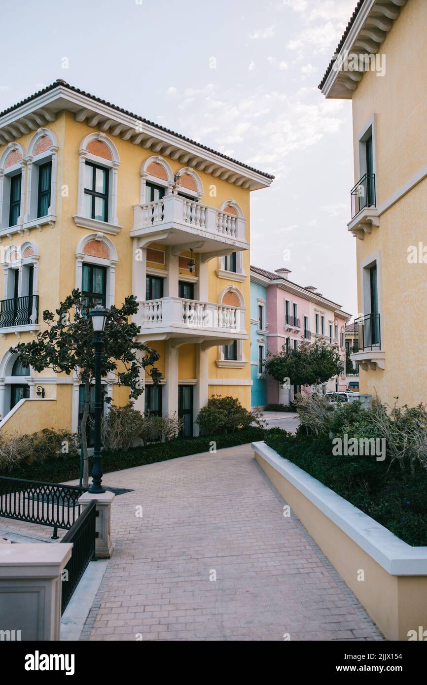 Apartment buildings with ornamental windows and balconies located near ...