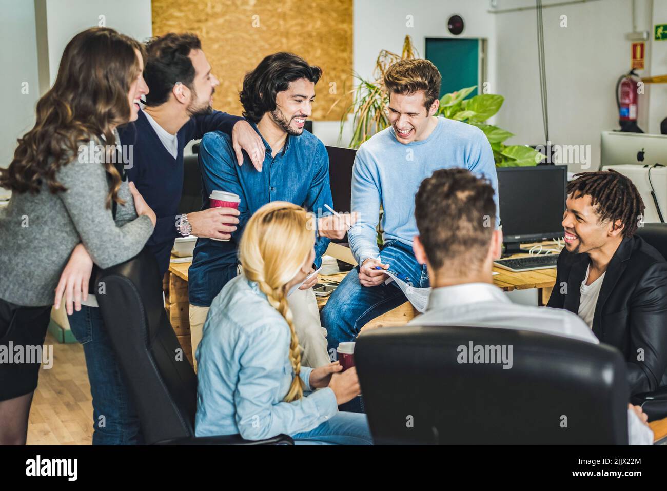 Concentrated group of workers in formal wear working with documents ...