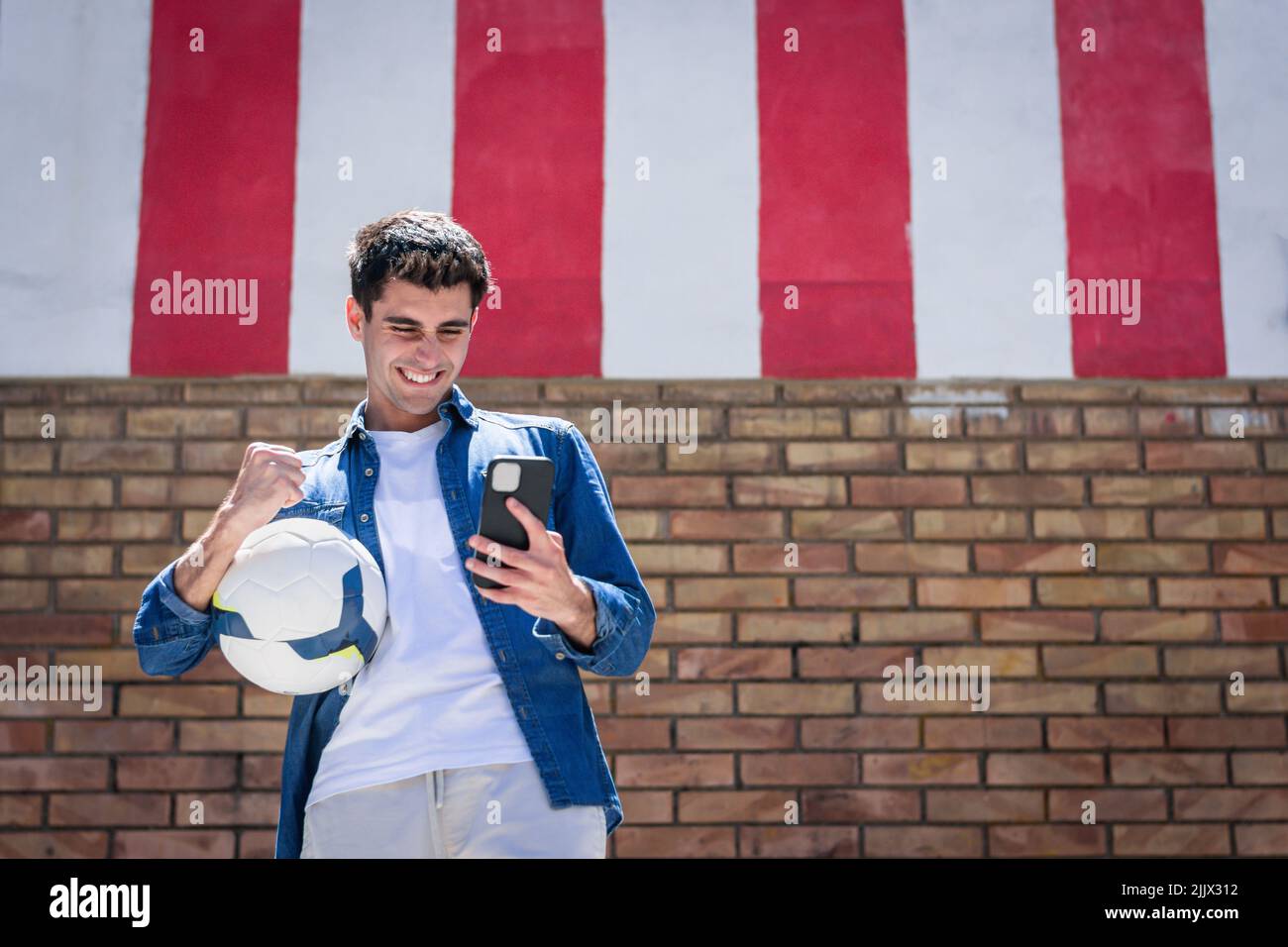 Man clenching fist holding hi-res stock photography and images - Alamy