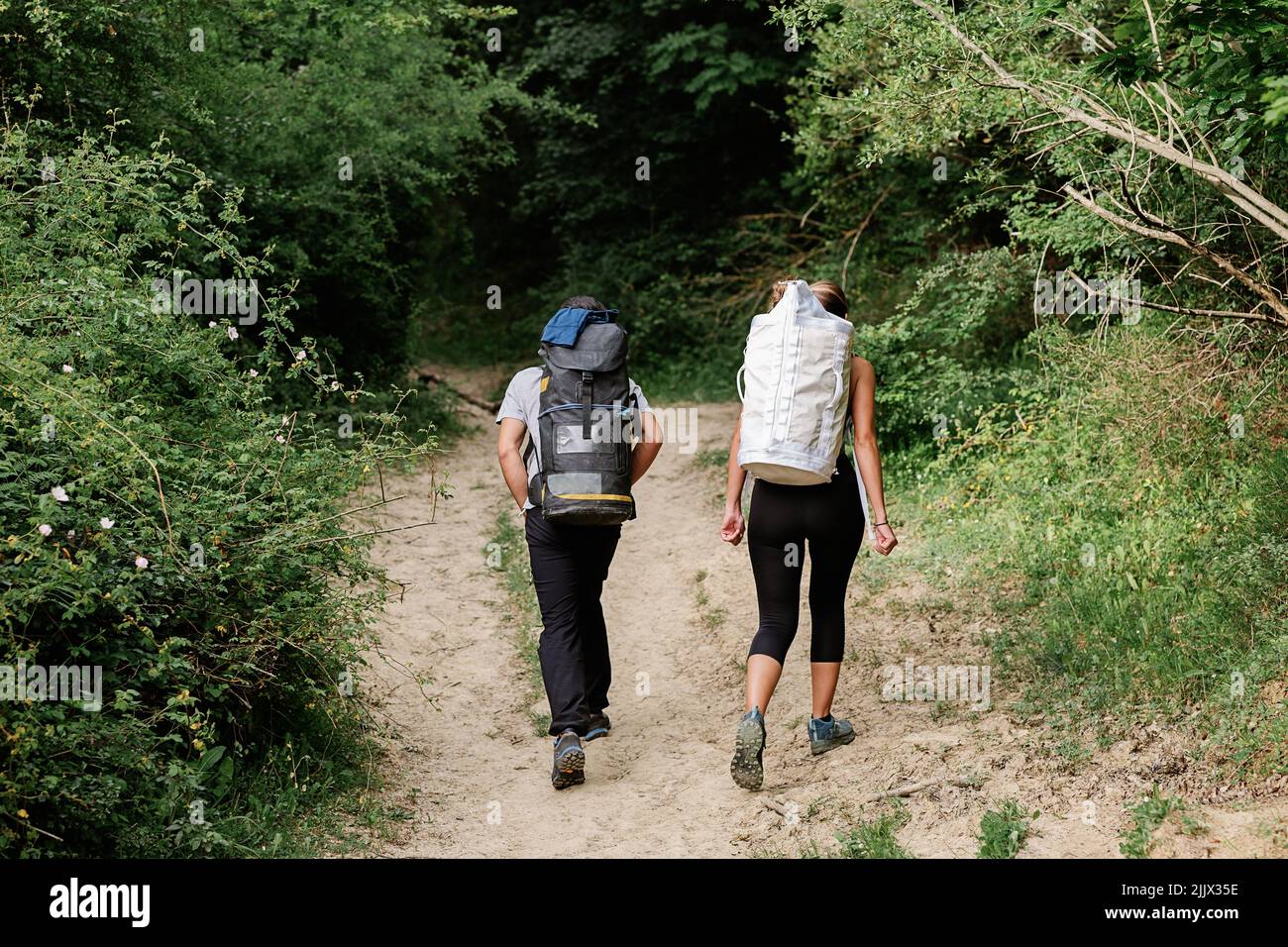 Back view of two hikers with backpacks hi-res stock photography and ...
