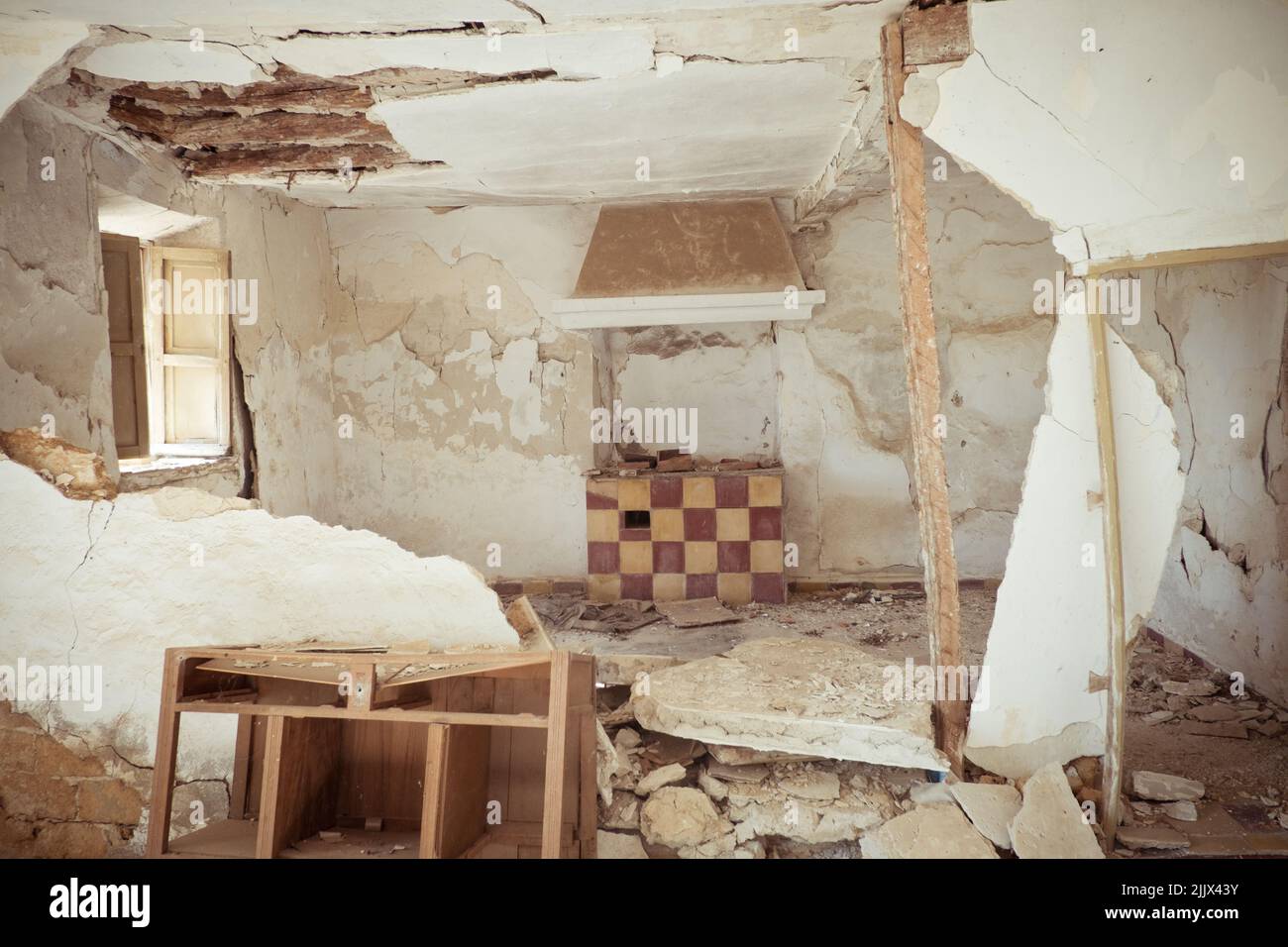 Interior of sunlit room with demolished walls and furniture inside ...