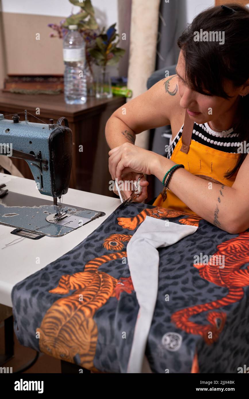 Crop of adult female designer with long dark hair in casual clothes and ...