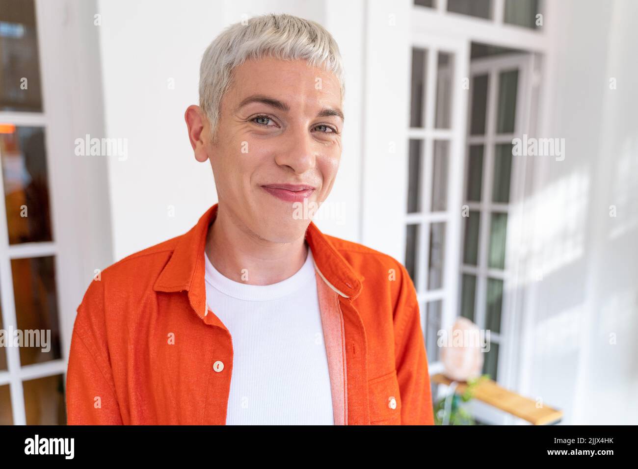 Portrait of young transgender man while looking at camera Stock Photo ...