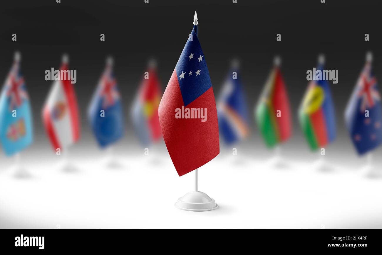 The national flag of the Samoa on the background of flags of other ...