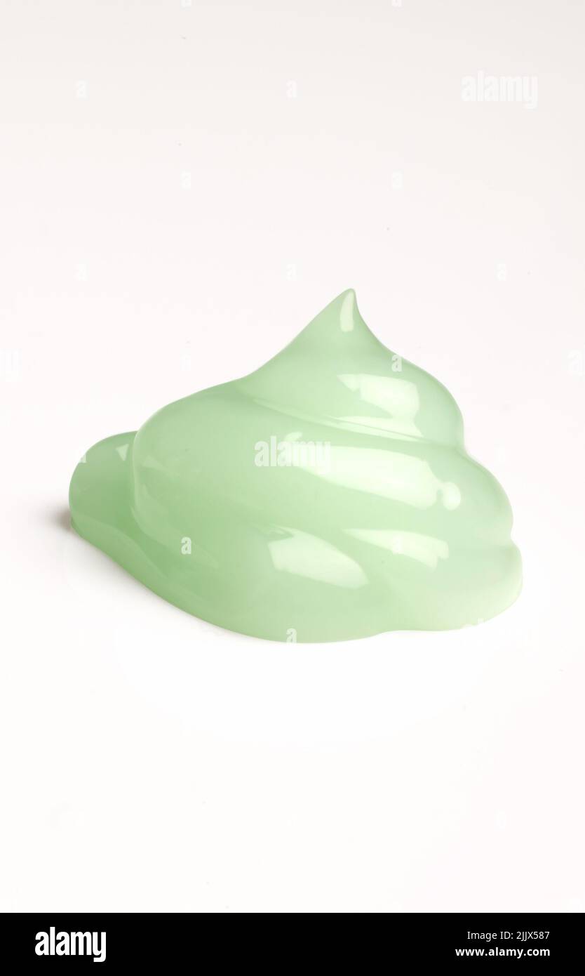 A green skin care cream isolated in white background Stock Photo - Alamy
