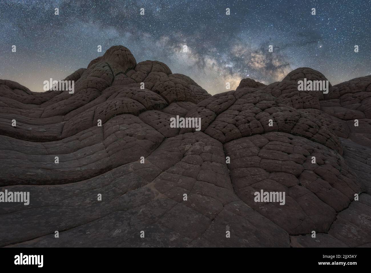 Scenery of rocky formations in highlands under milky way starry sky in ...