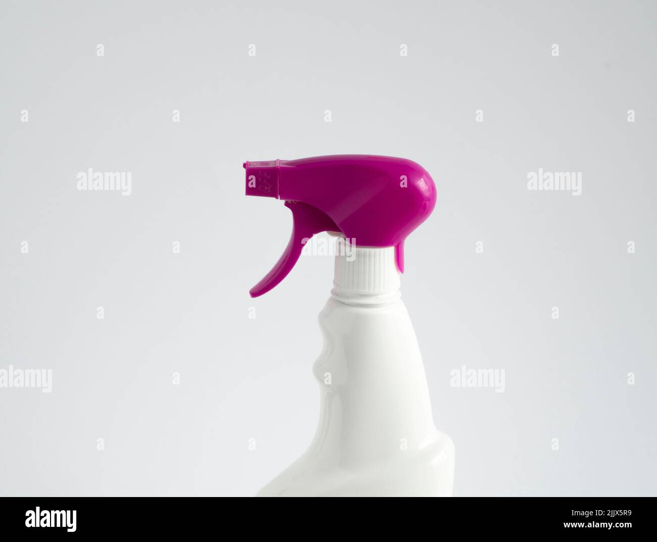 White blank plastic spray detergent bottle with a violet sprayer ...