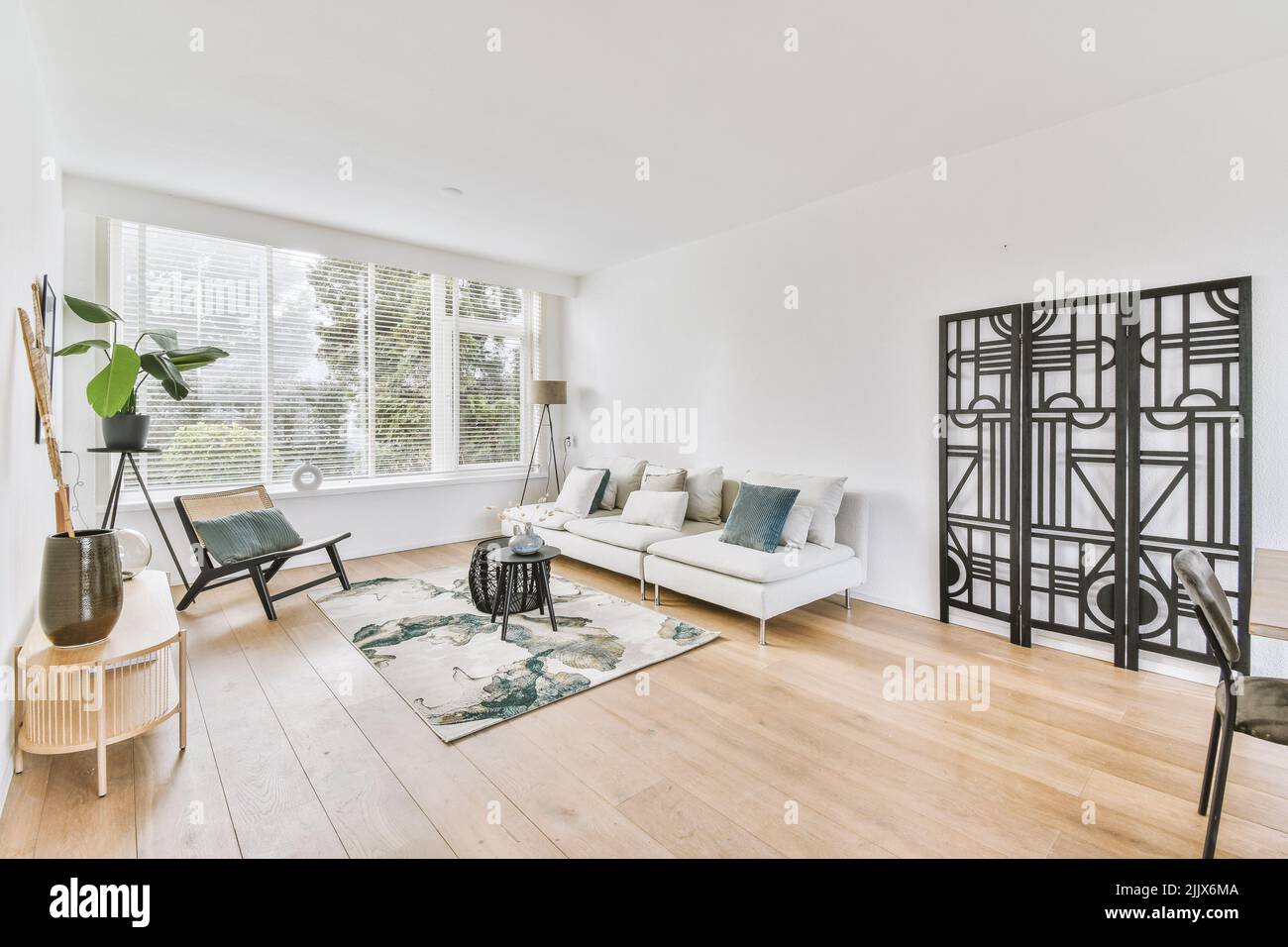 Interior of modern home with furniture next to a bright window Stock ...