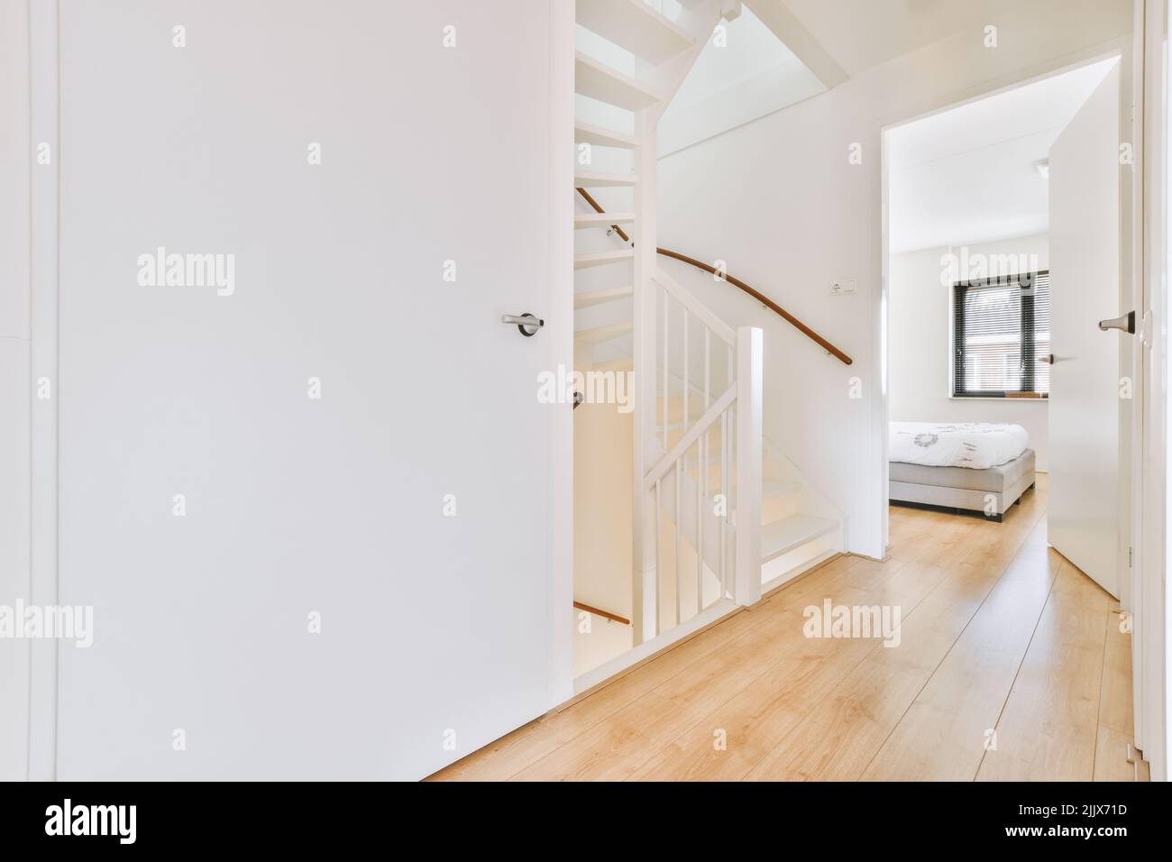 Interior passage way in bright modern house with parquet floor Stock Photo - Alamy