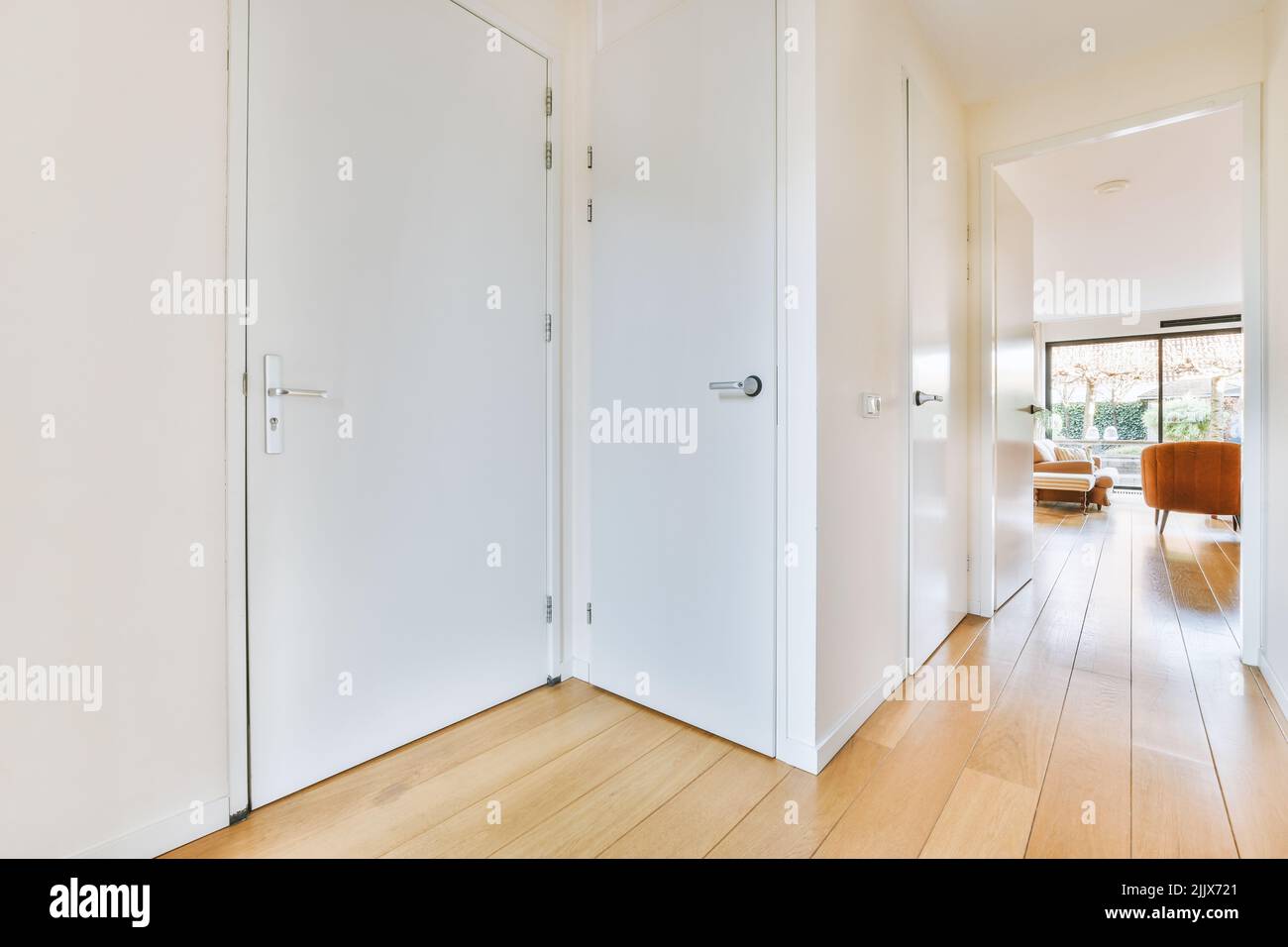 Interior passage way in bright modern house with parquet floor Stock ...