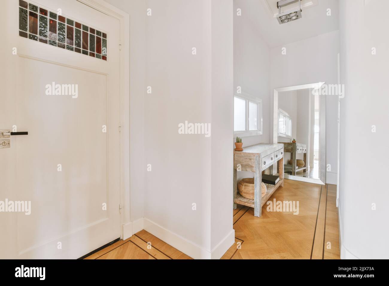 Interior passage way in bright modern house with parquet floor Stock Photo - Alamy