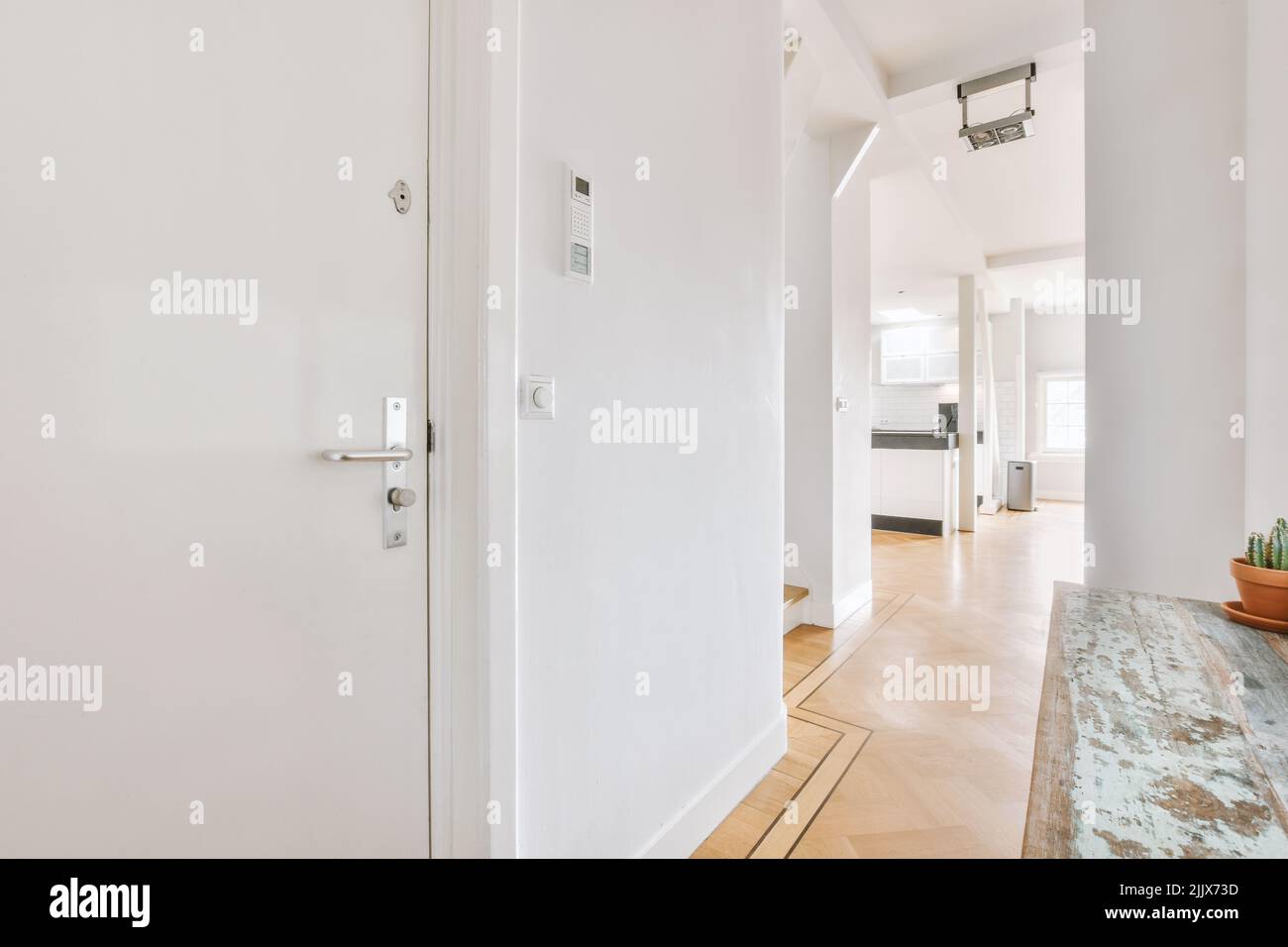 Interior passage way in bright modern house with parquet floor Stock Photo - Alamy