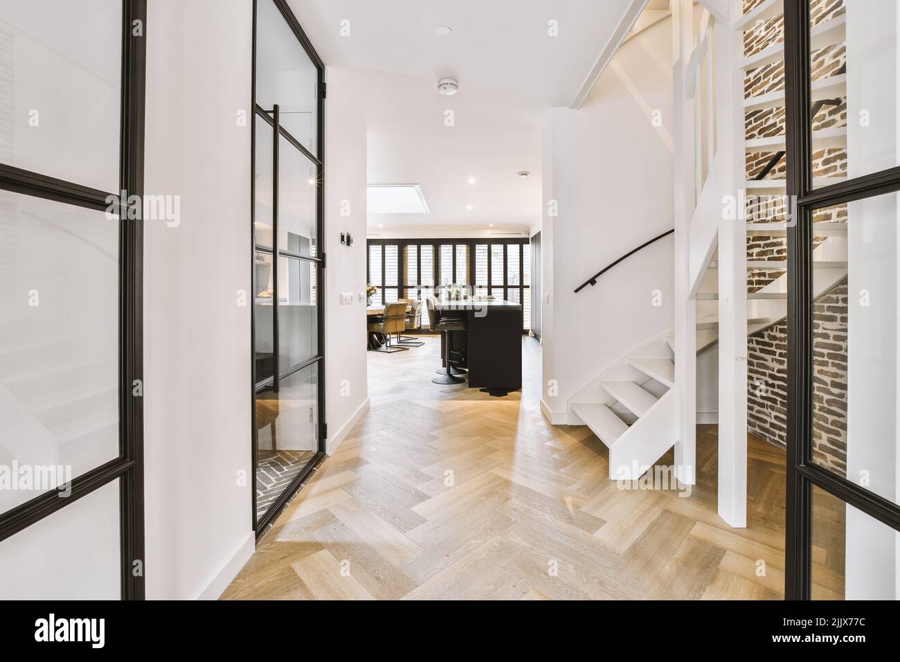 Interior passage way in bright modern house with parquet floor Stock ...