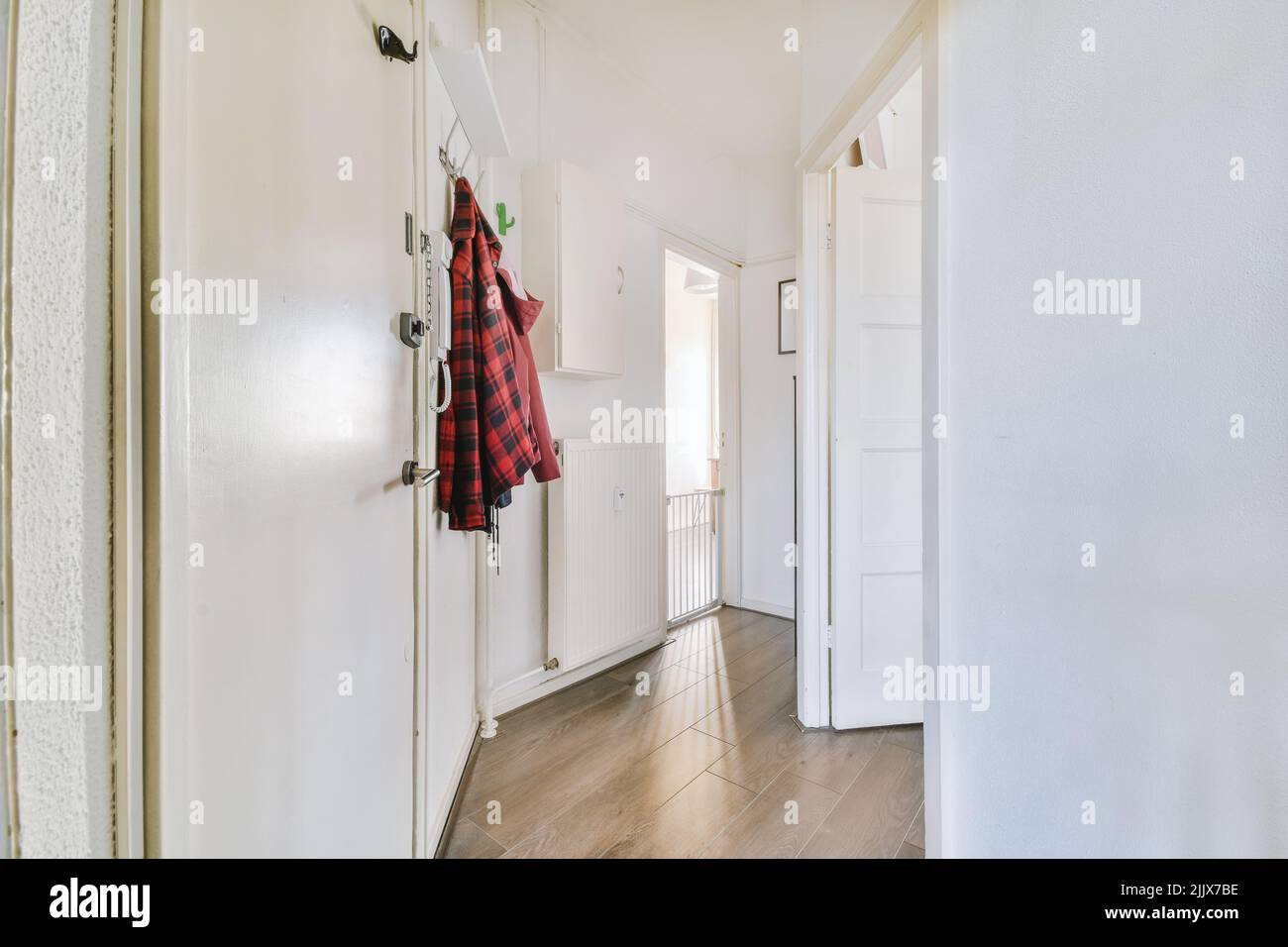 Interior passage way in bright modern house with parquet floor Stock ...