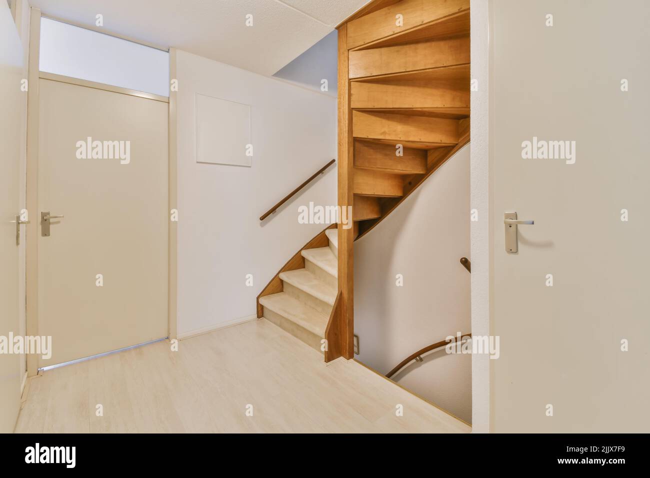 Interior of a house with stairs to an upper floor in a bright ...