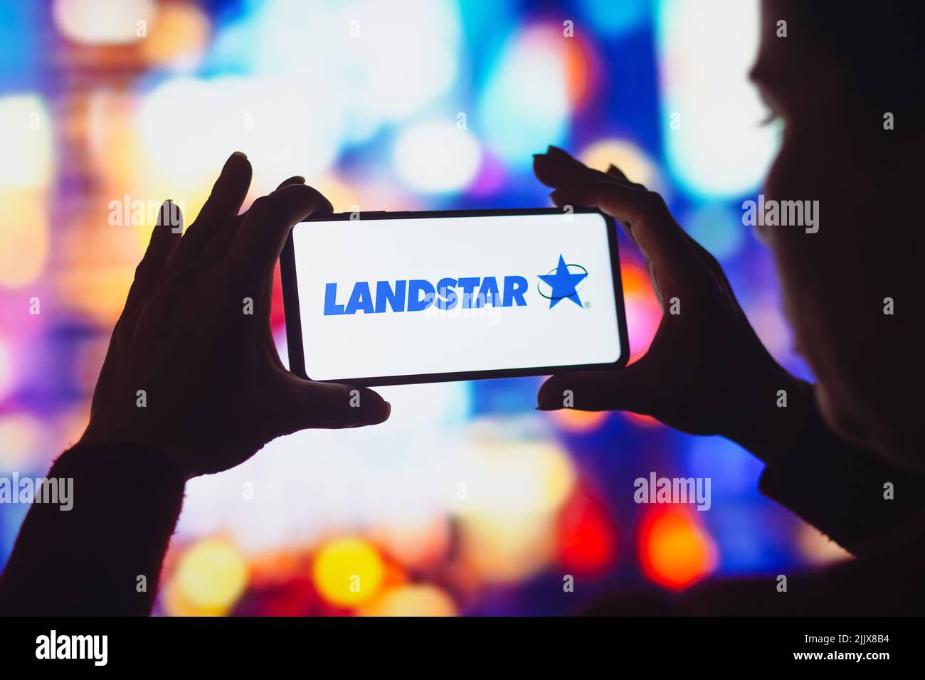 In this photo illustration, the Landstar System logo is displayed on a ...