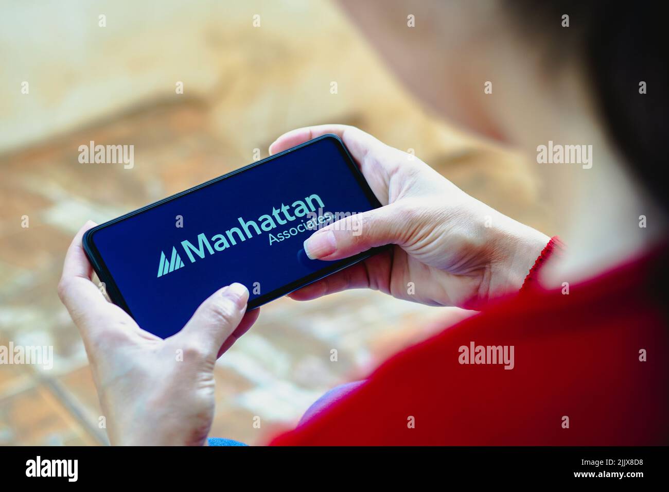 In this photo illustration, the Manhattan Associates logo is displayed ...