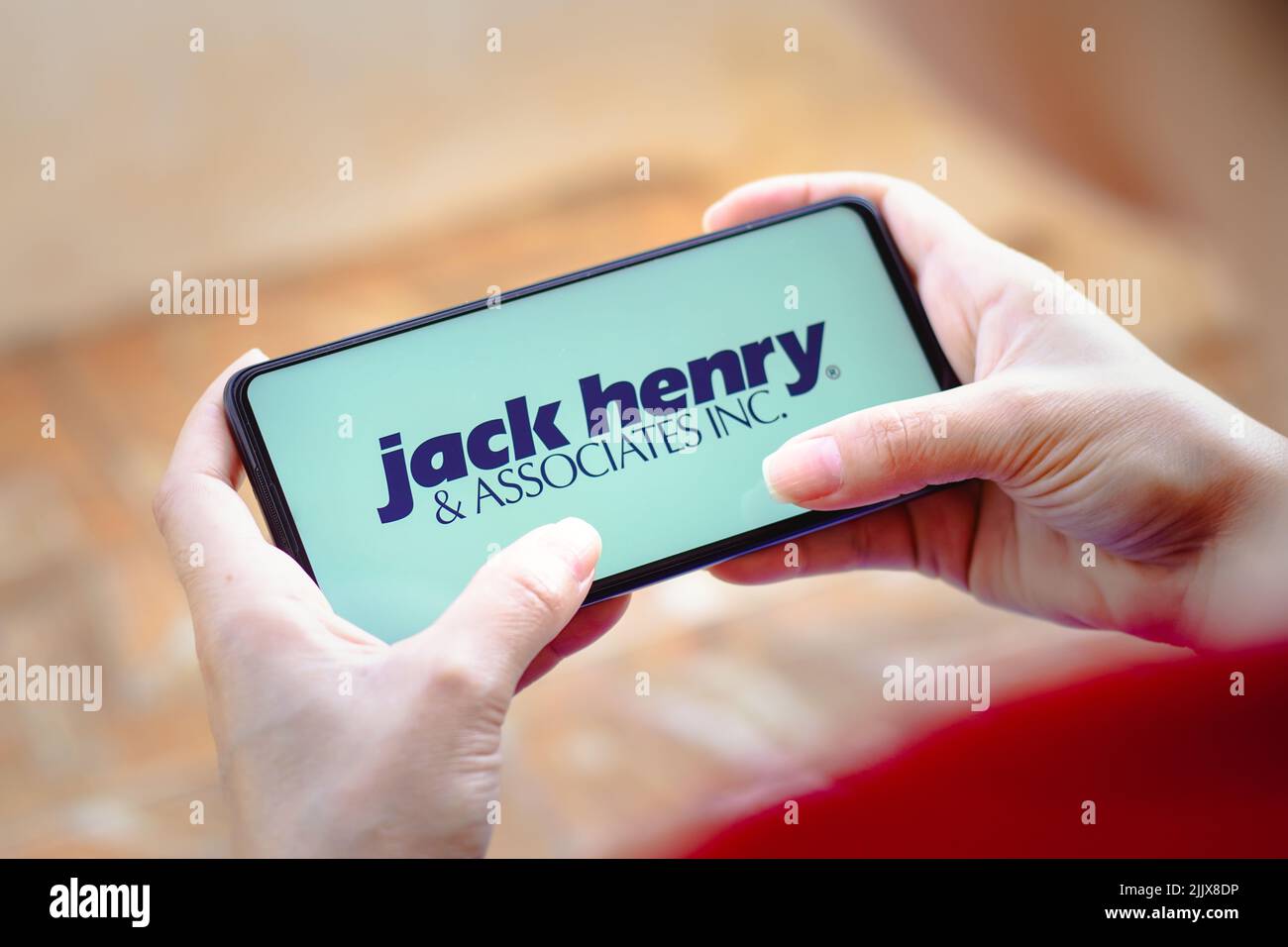 In this photo illustration, the Jack Henry and Associates logo is ...