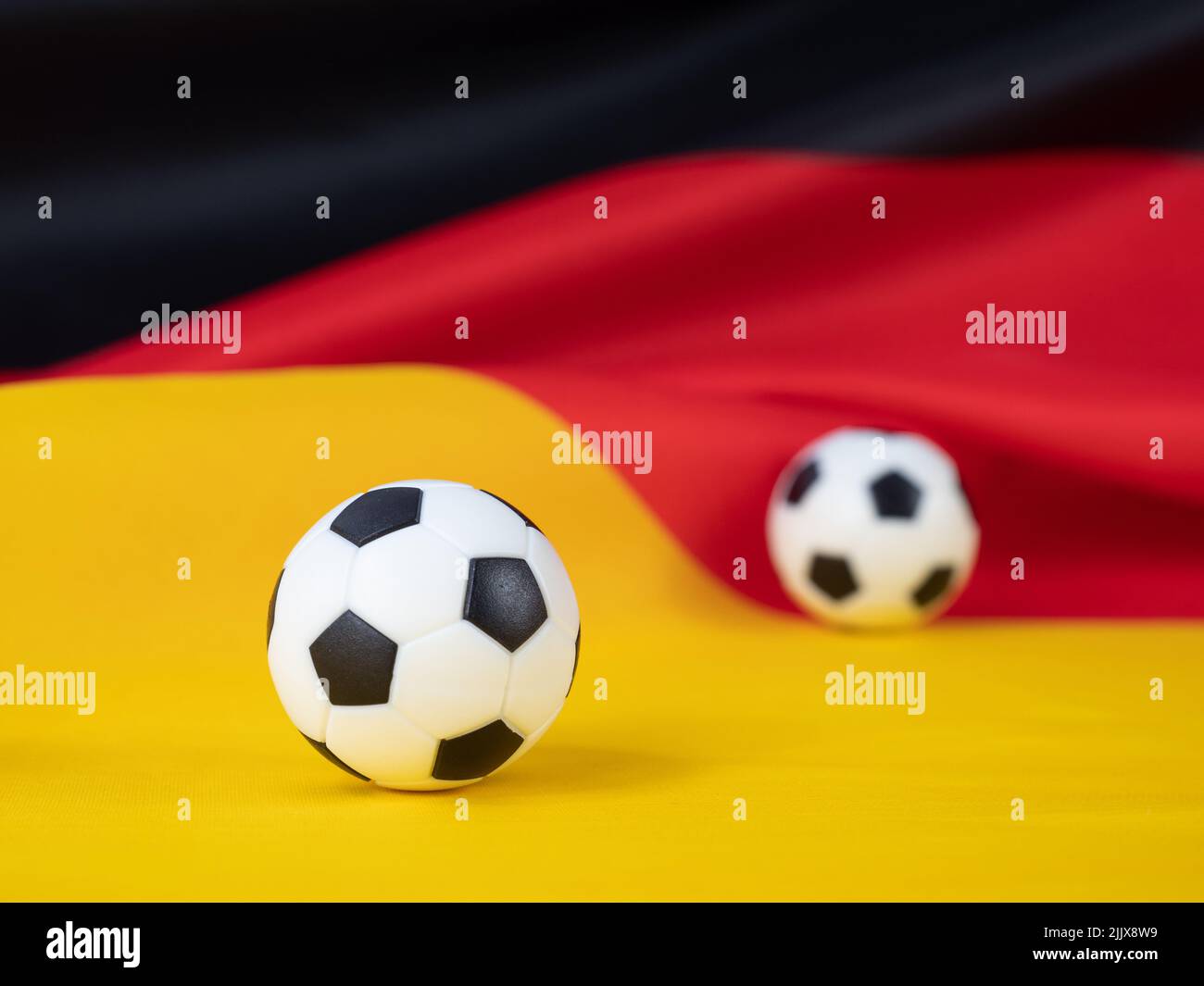 Soccer ball on the German flag. The ball against the background of the ...