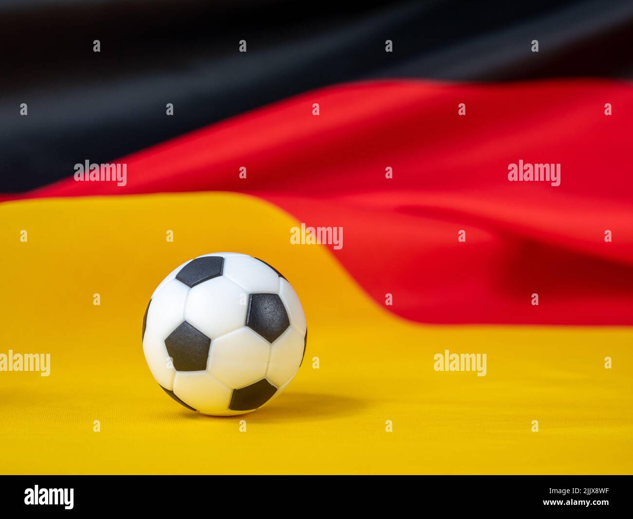 Soccer ball on the German flag. The ball against the background of the ...