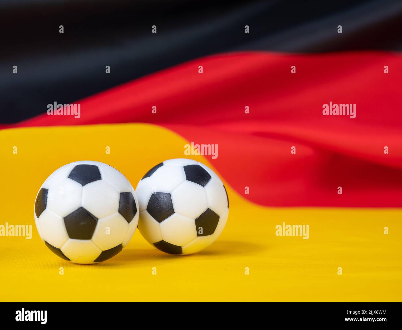 Soccer ball on the German flag. The ball against the background of the ...