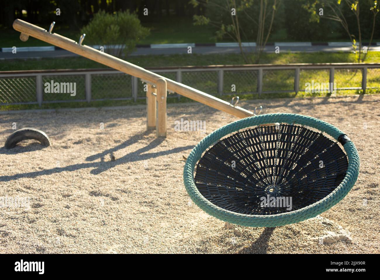 Children's playground with round swings. Details of park. Children's ...
