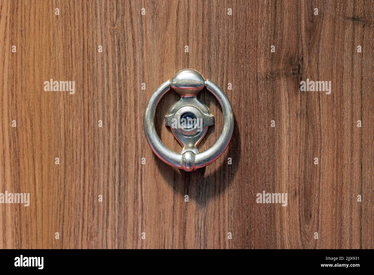 Round Metal Knocker With Integrated Peephole Lens at Wooden Door Stock ...