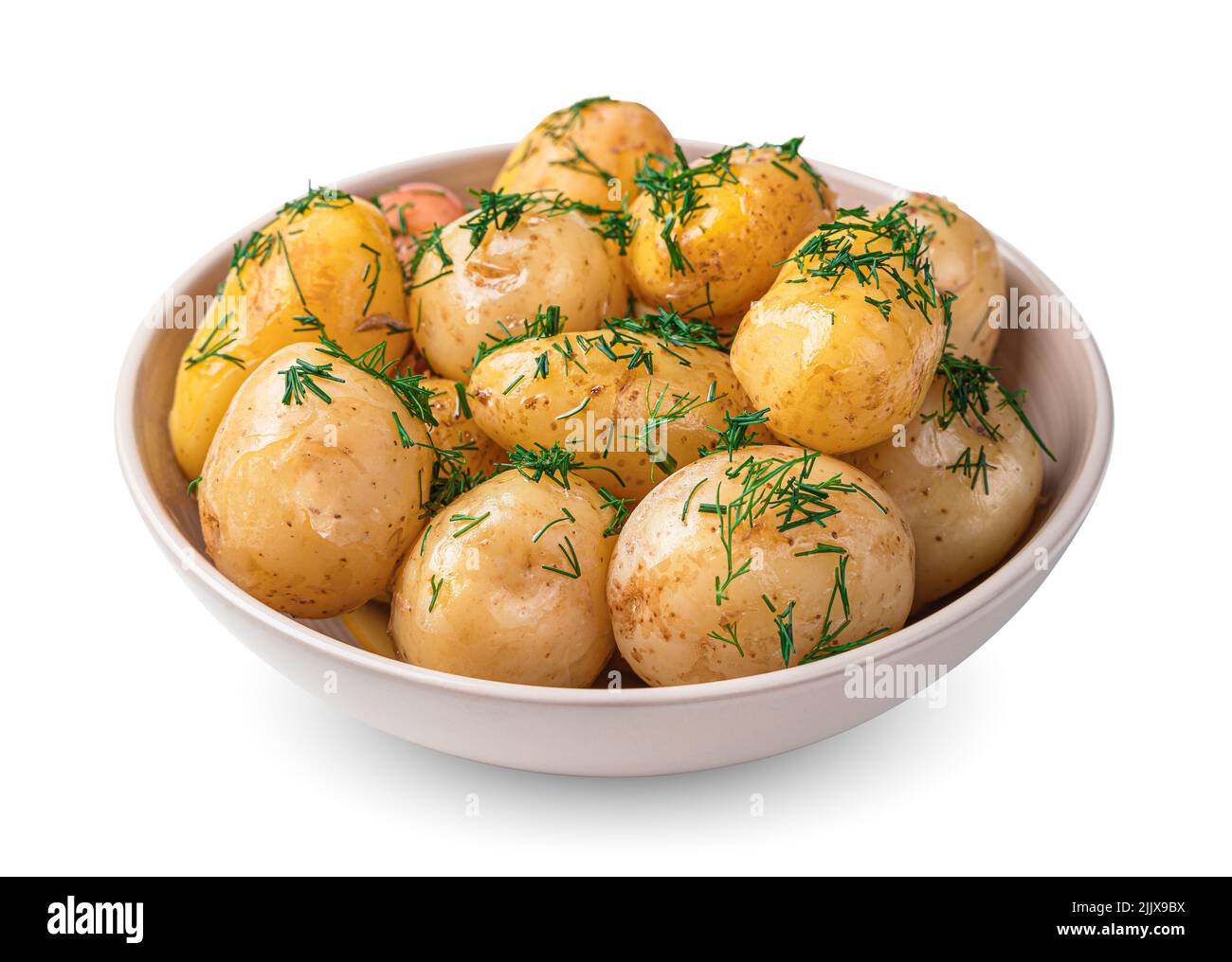 Boiled unpeeled potatoes with fresh dill and butter are isolated on a ...