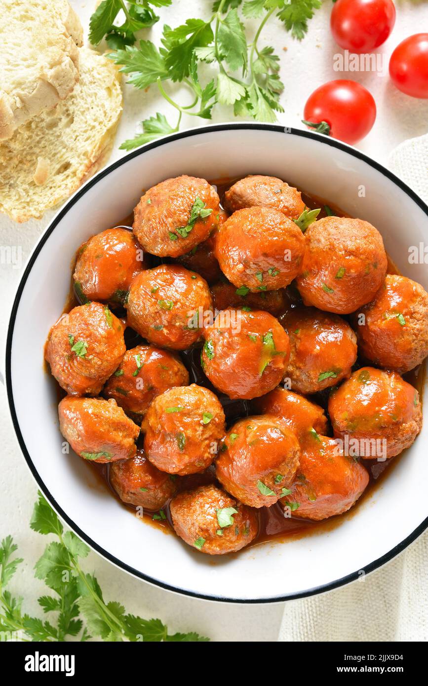 Close up view of meatballs with tomato sauce in bowl. Top view, flat ...