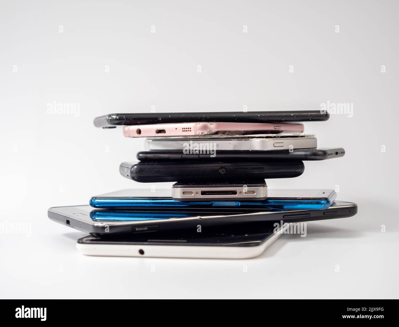 Pile mobile phone heap different hi-res stock photography and images ...