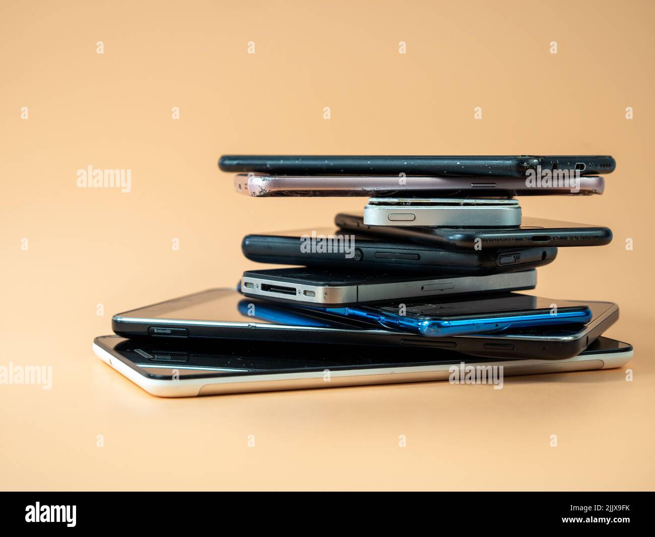 Pile mobile phone heap different hi-res stock photography and images ...
