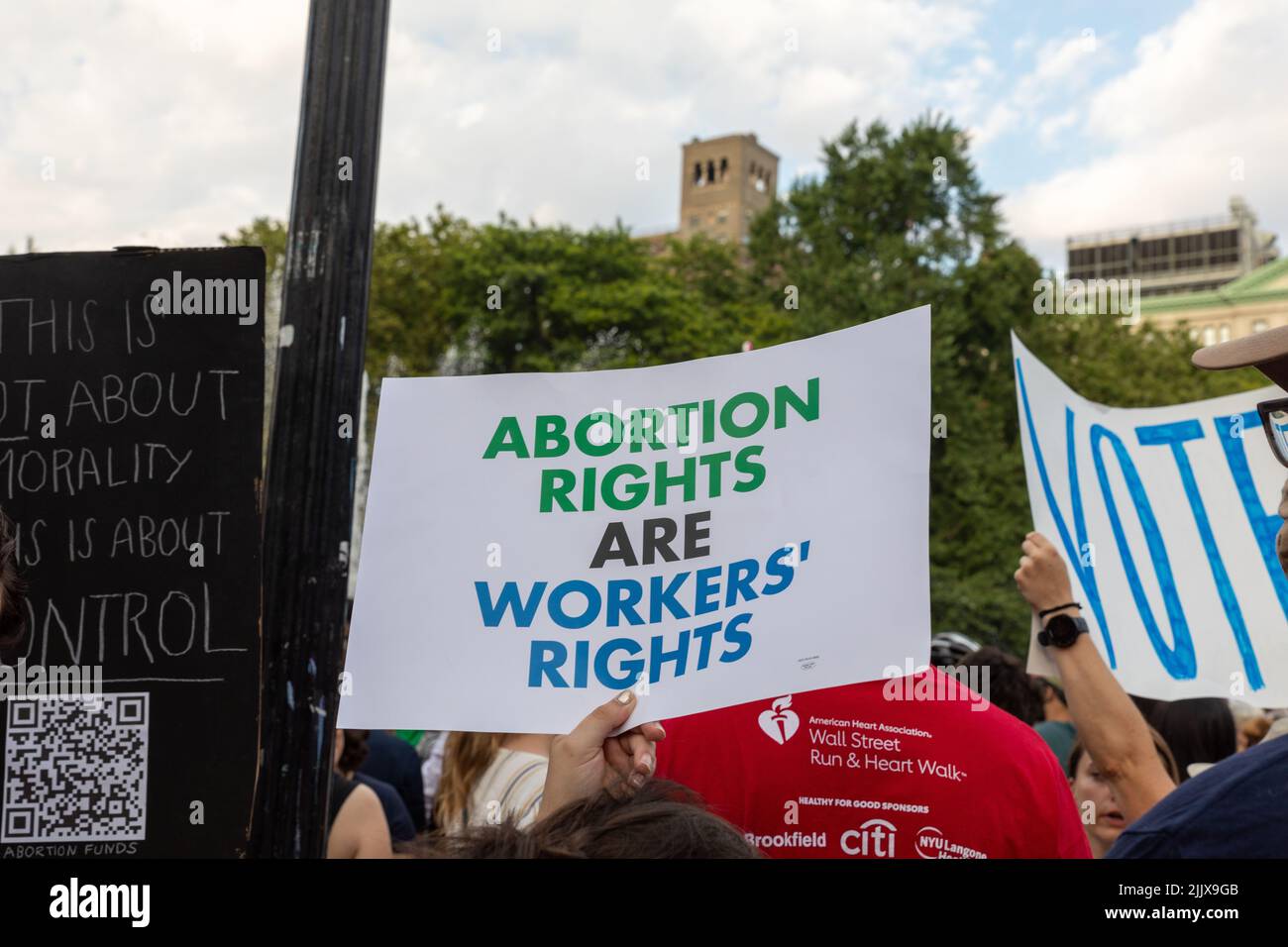 The protesters holding out cardboard signs about body freedom after ...