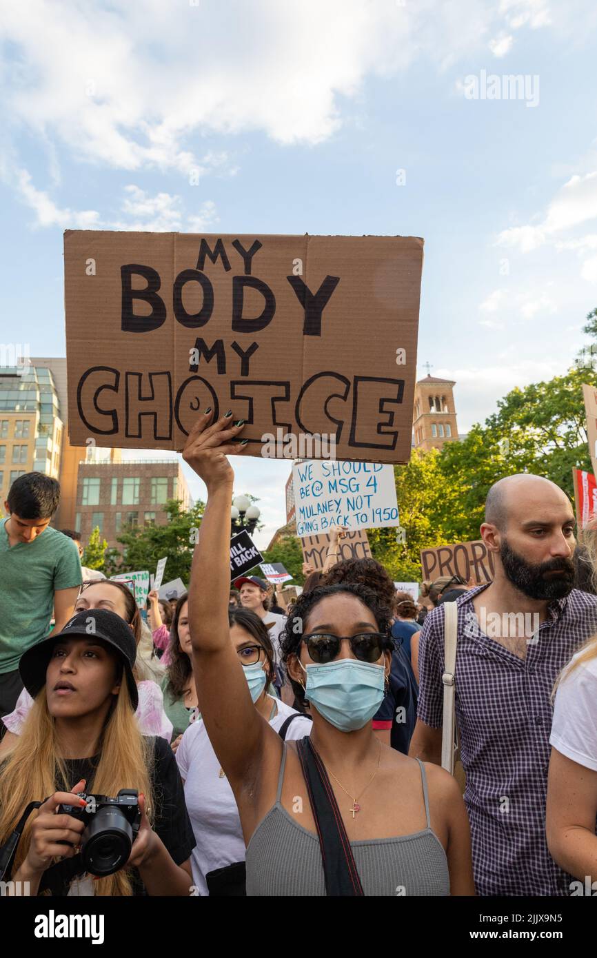 The protesters holding out cardboard signs about body freedom after ...